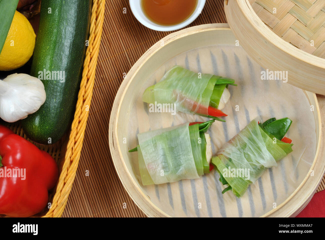 asian style chicken and vegetable bundles Stock Photo - Alamy