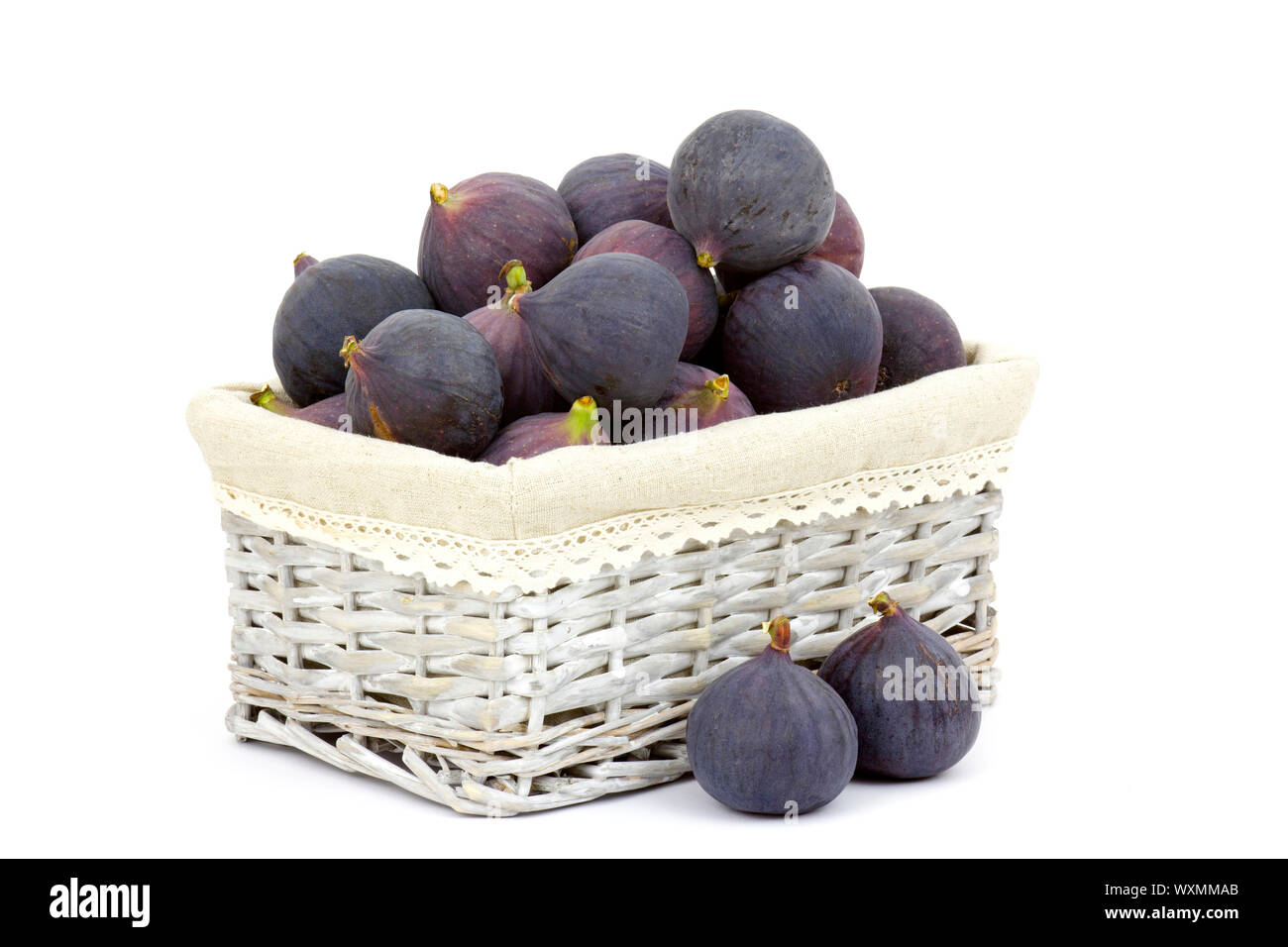 Figs in basket Cut Out Stock Images & Pictures - Alamy