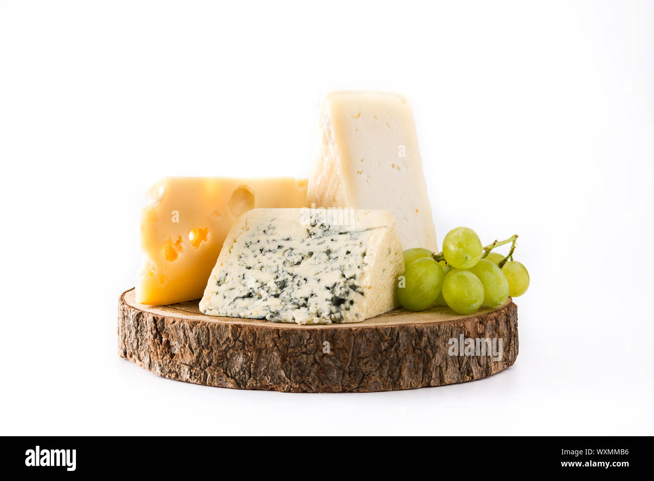 Different types of cheeses and green grapes isolated on white ...