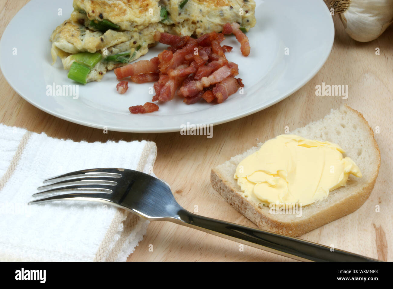 scrambled eggs with grilled bacon bits on a plate Stock Photo - Alamy