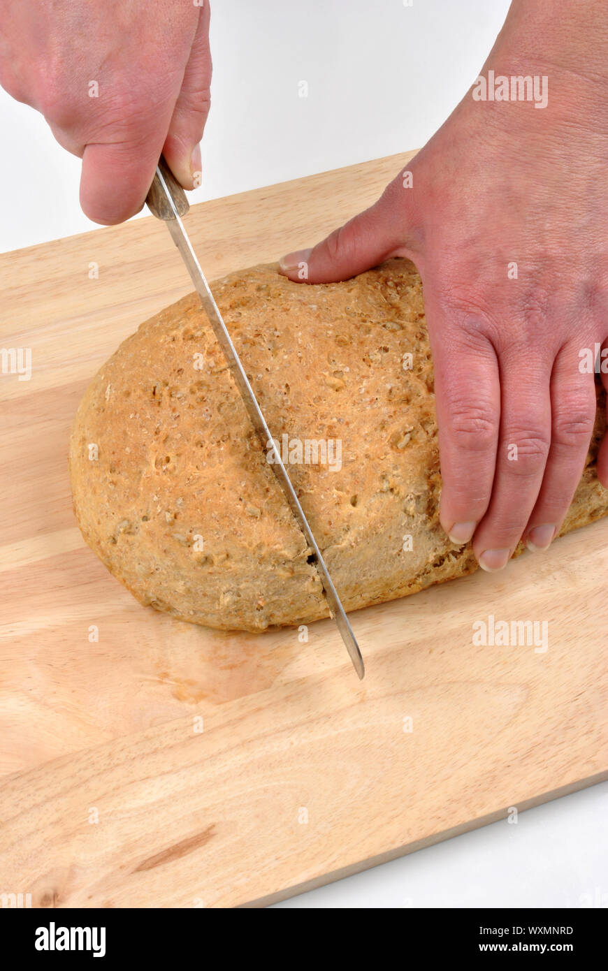 how to cut organic bread at home Stock Photo - Alamy