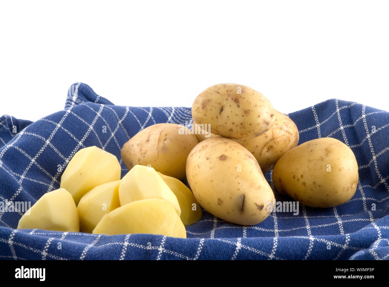 potatoes peeled and unpeeled Stock Photo - Alamy