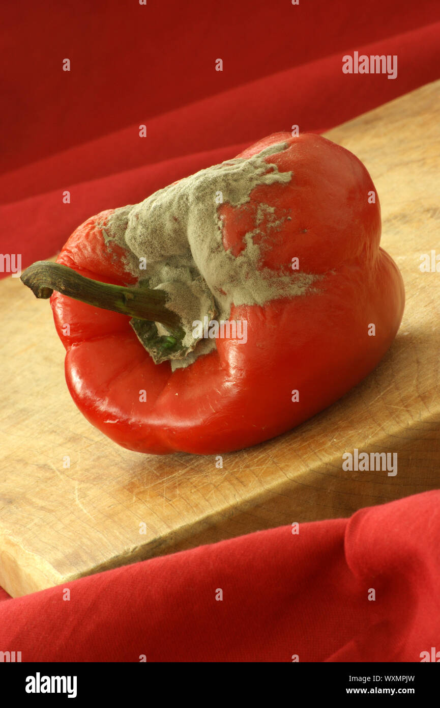 mouldy organic vegetable unhealthy to eat on a timber board Stock Photo ...