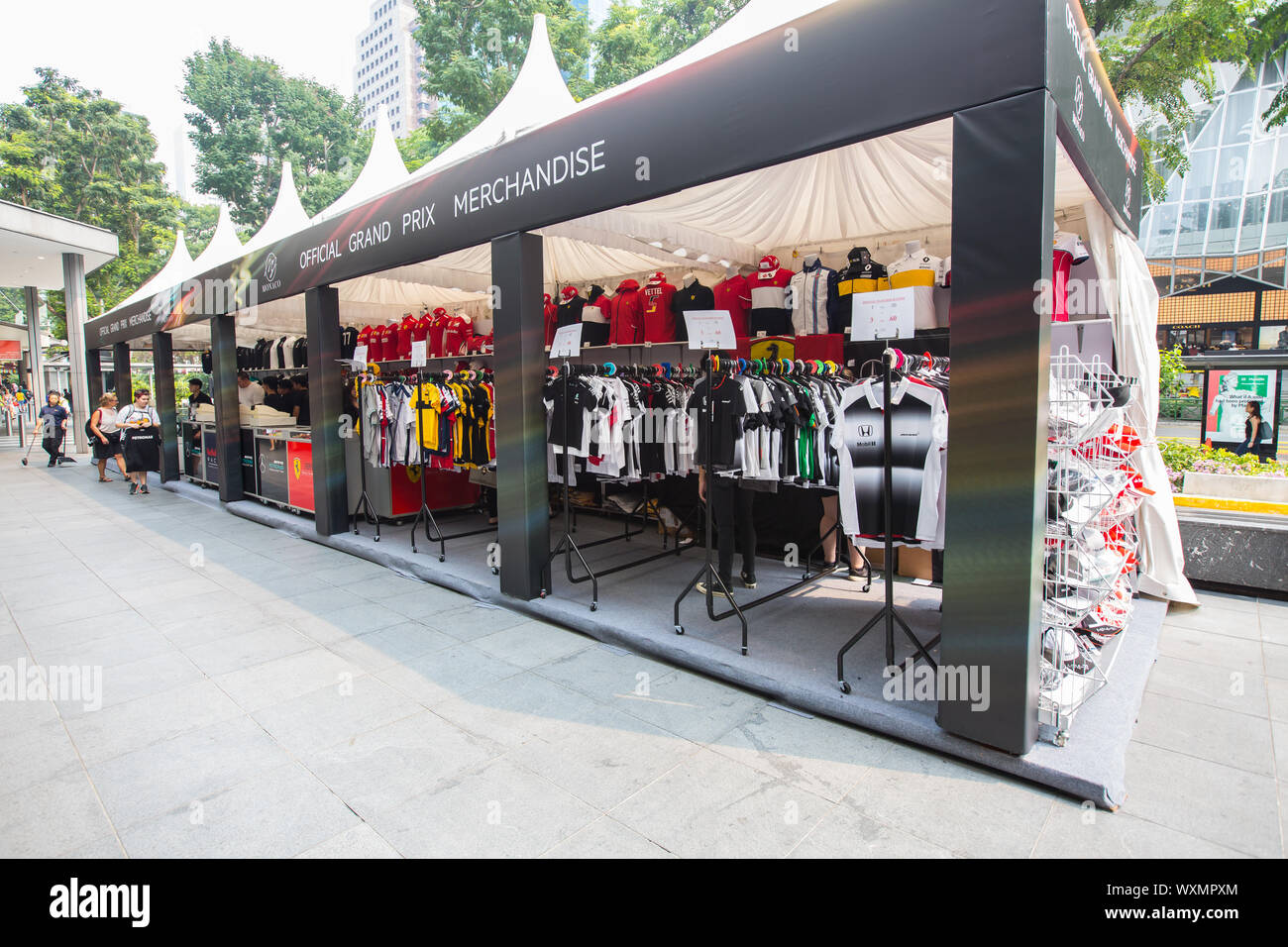 Formula One merchandise booth selling Mercedes, Red, Ferrari F1 products to boost sales. Orchard ...