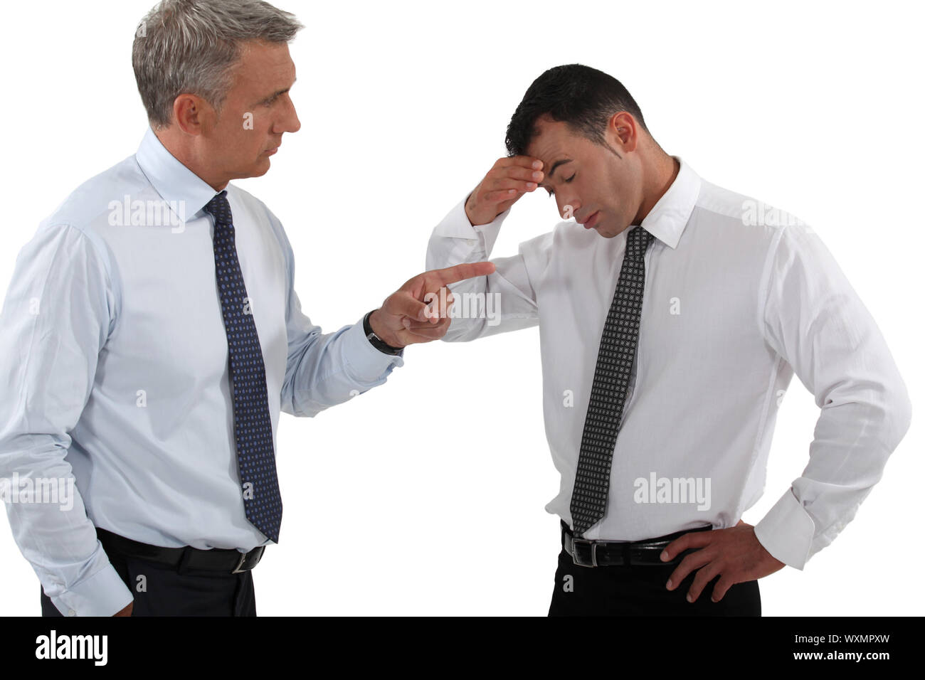 Chief taunting employee Stock Photo - Alamy