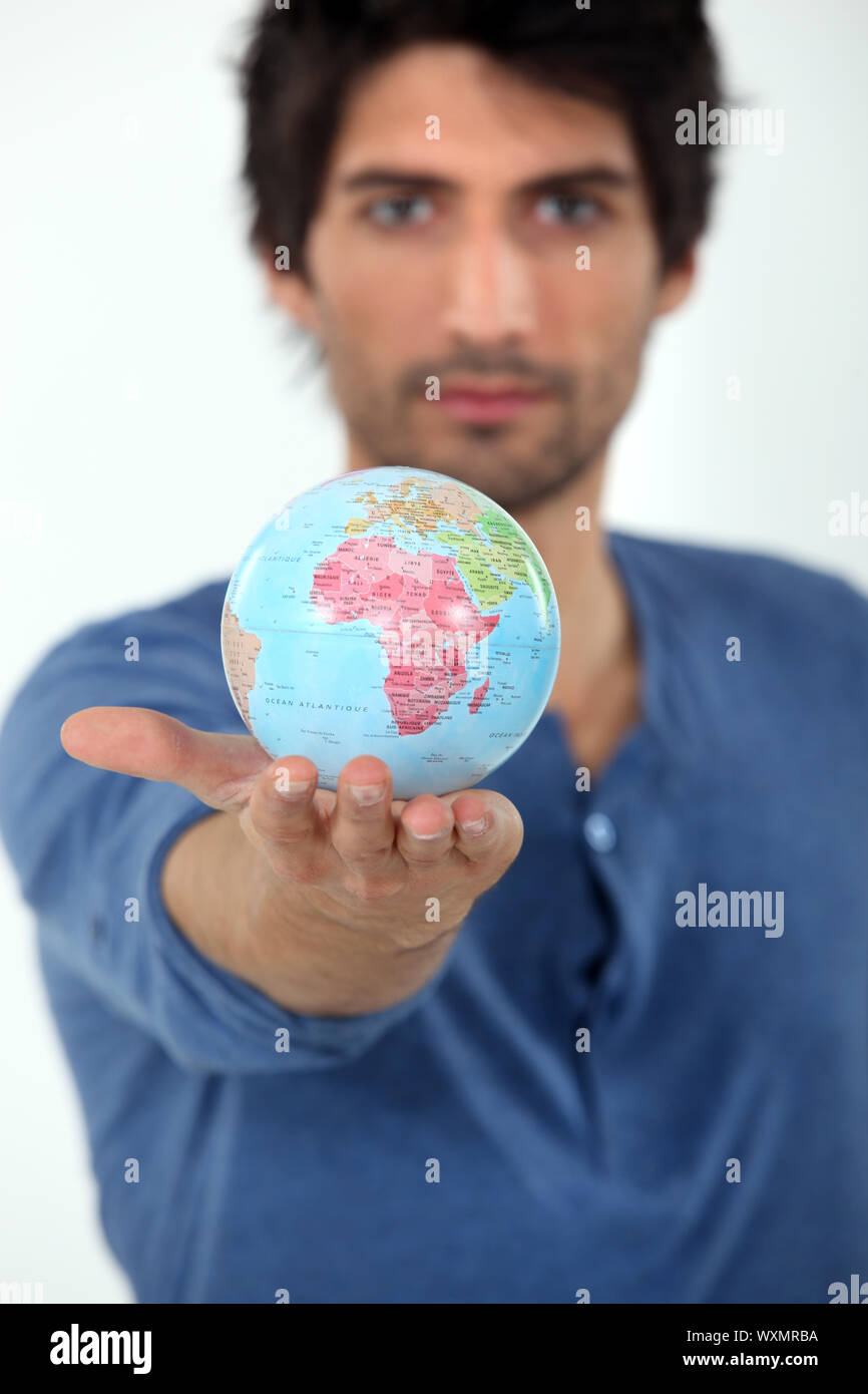 Man holding the world in the palm of his hand Stock Photo - Alamy