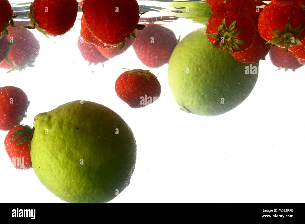 lime splash isolated on white background Stock Photo - Alamy