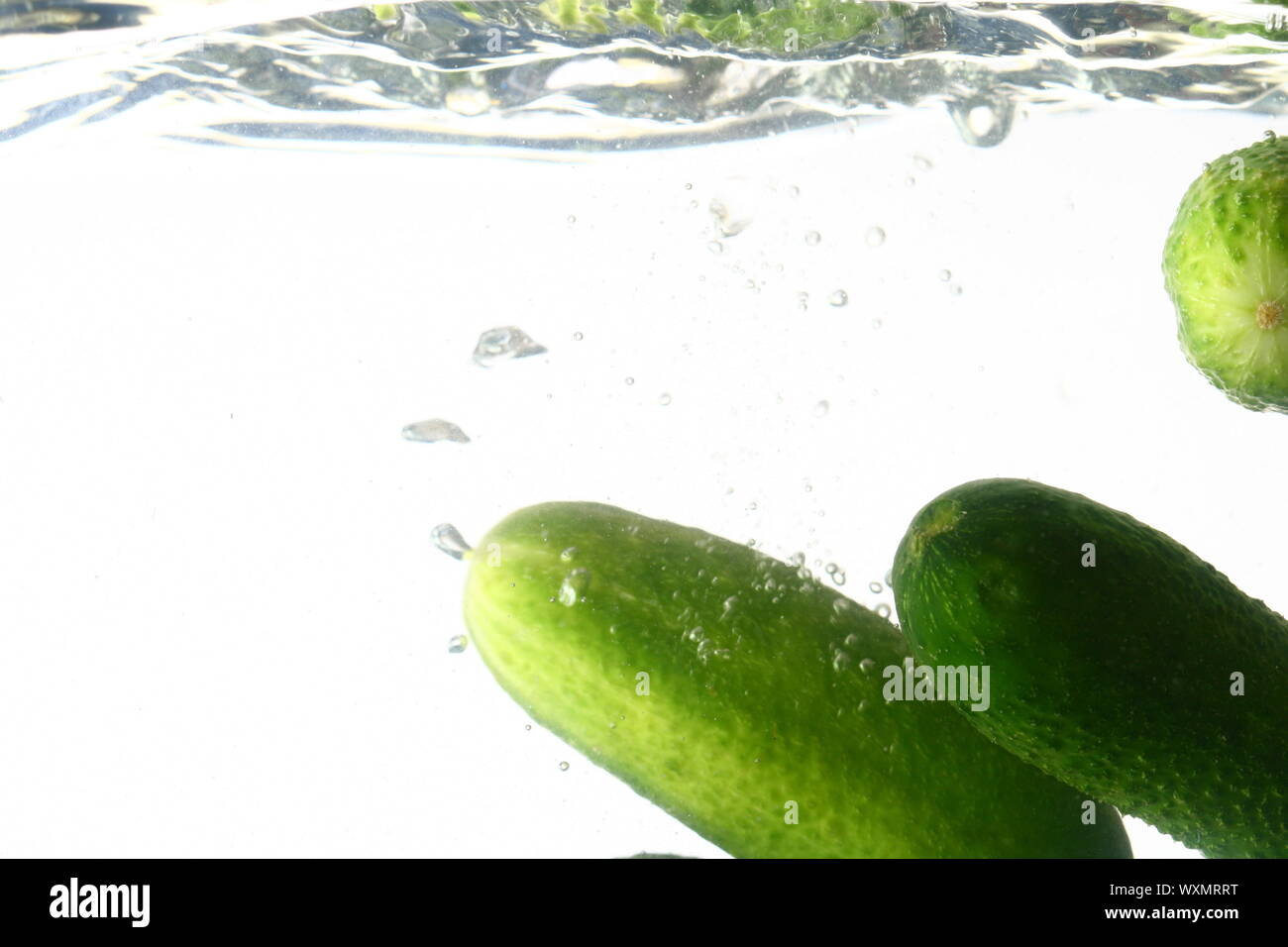 cucumber splash isolated on white background Stock Photo - Alamy