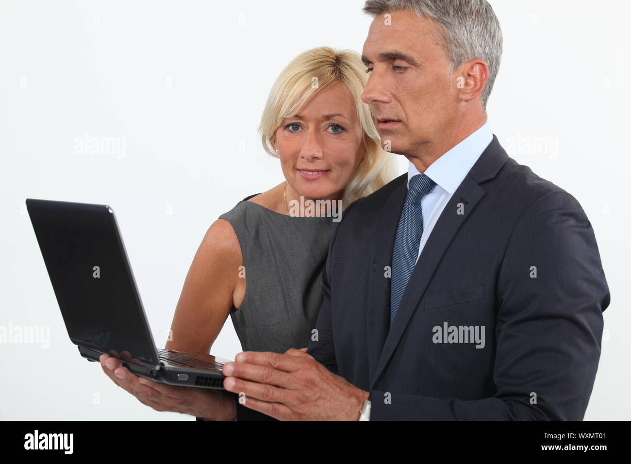 Man and woman with computer Stock Photo - Alamy