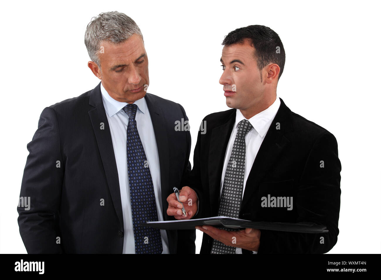 Assistant stood with boss Stock Photo - Alamy