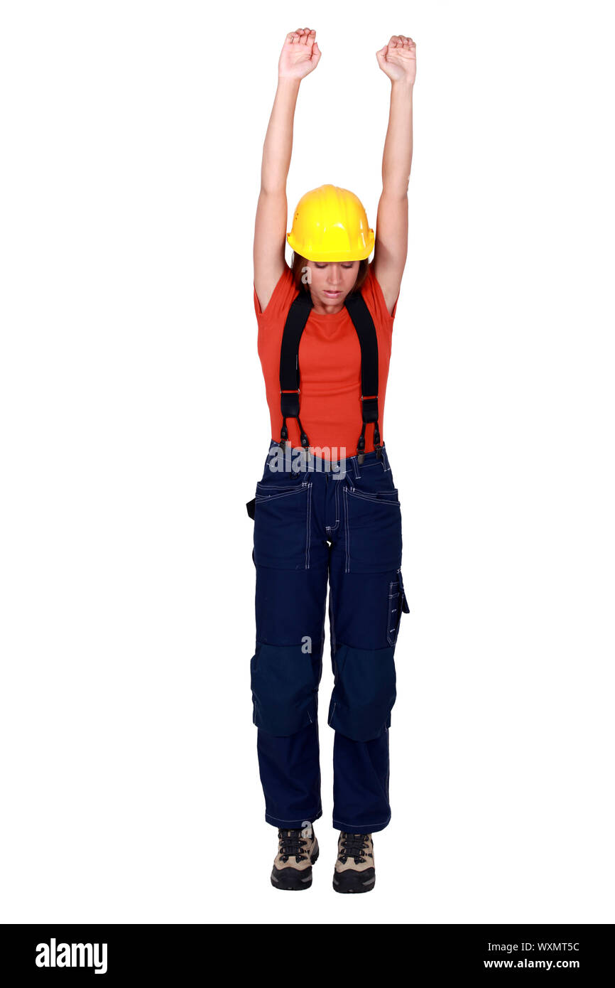 Female construction worker hanging in empty copyspace Stock Photo - Alamy