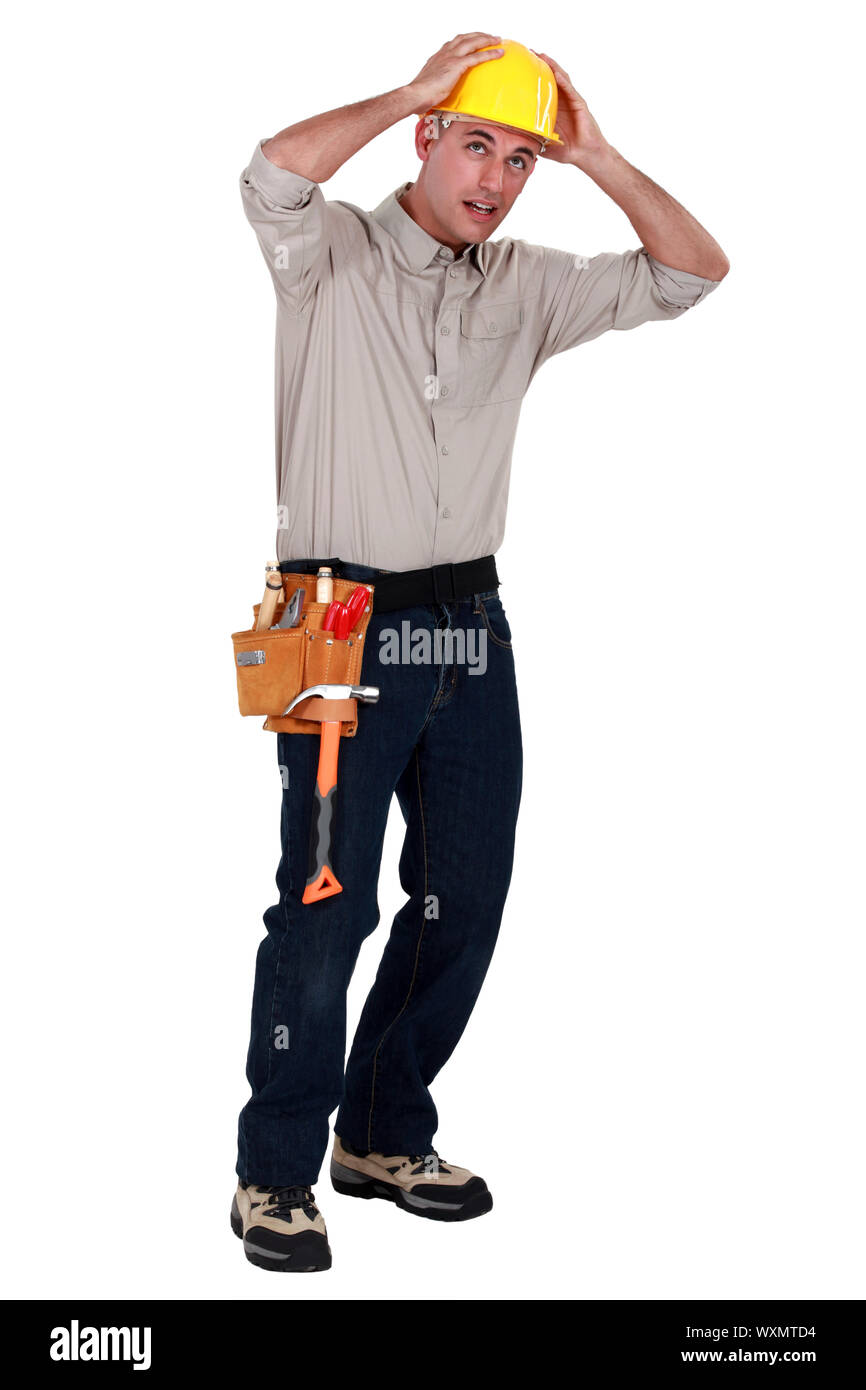 Builder covering head Stock Photo - Alamy