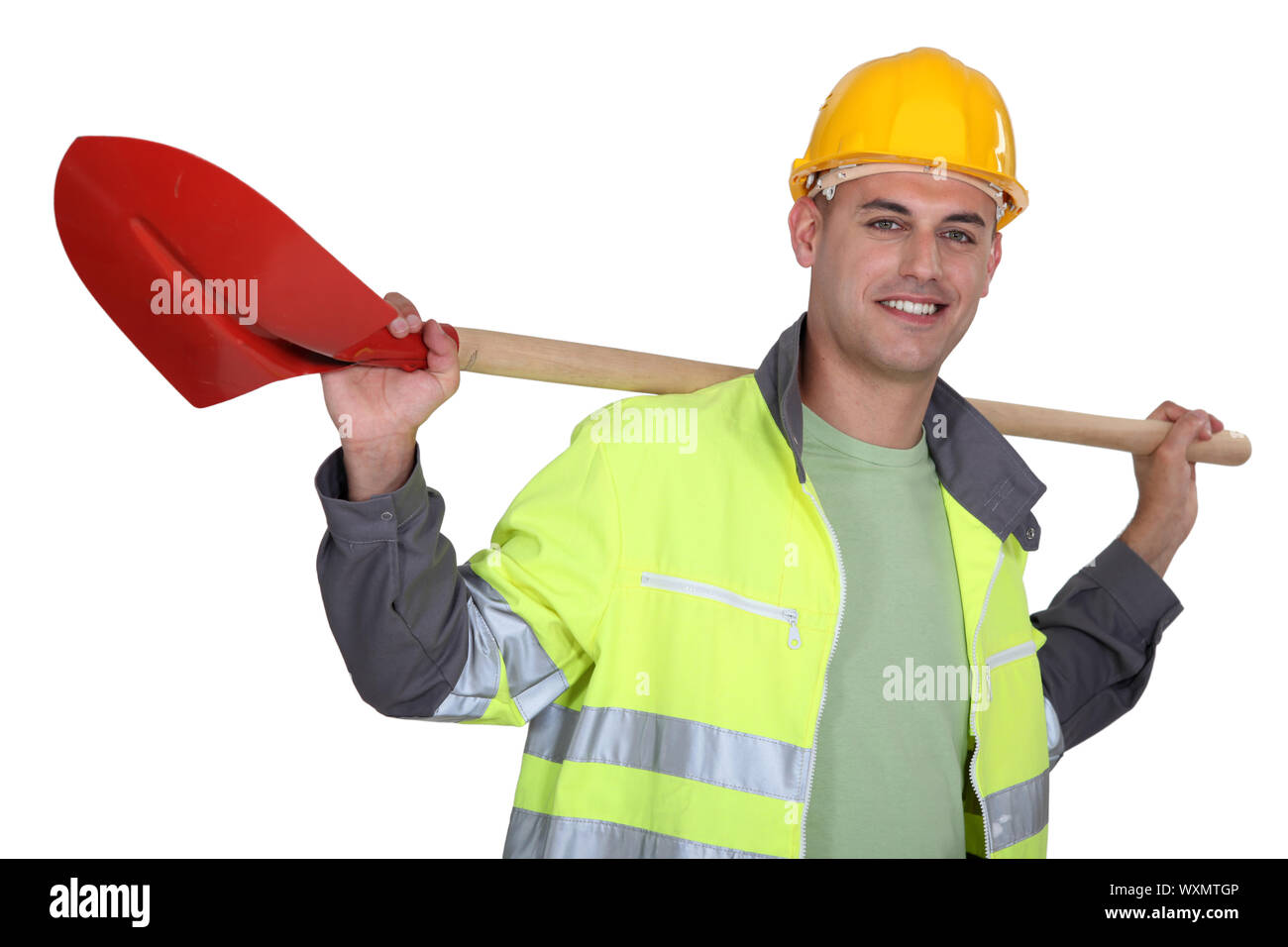 Tradesman carrying a spade on his shoulders Stock Photo - Alamy