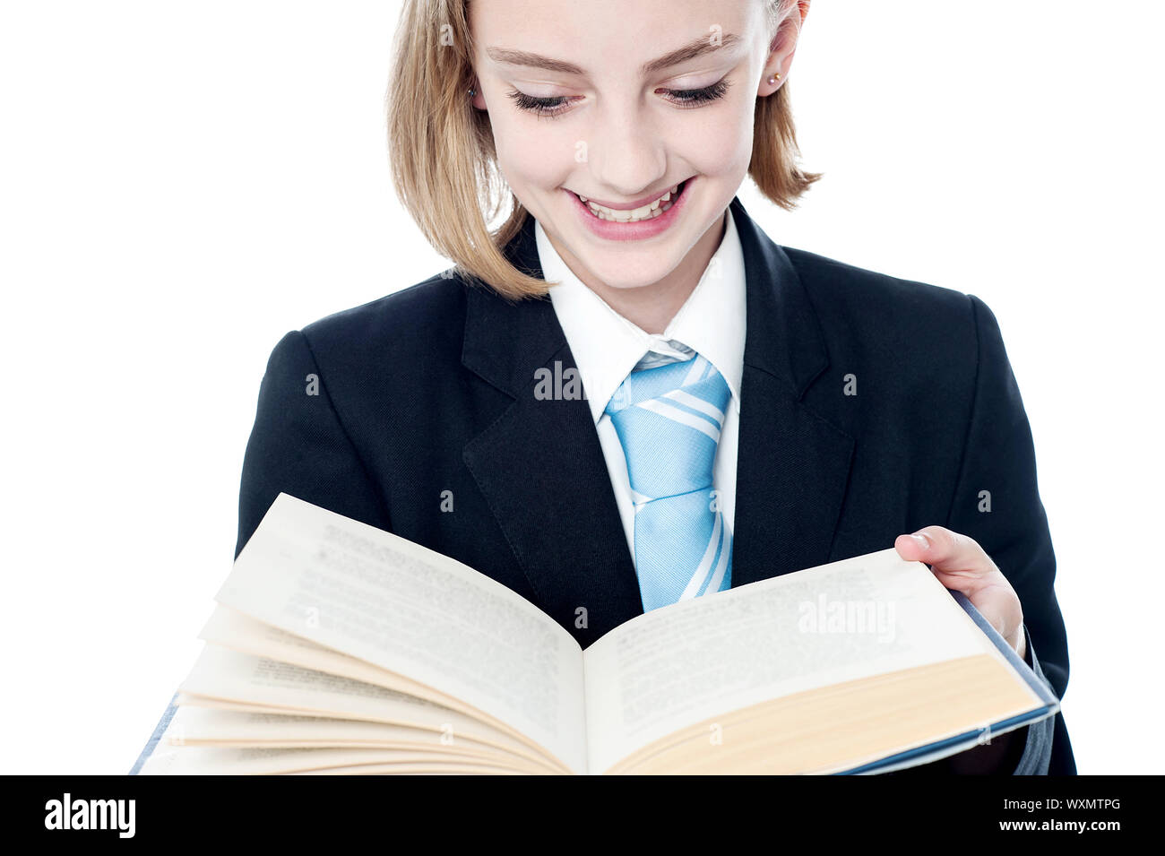 Young girl in business suit reading a book Stock Photo - Alamy