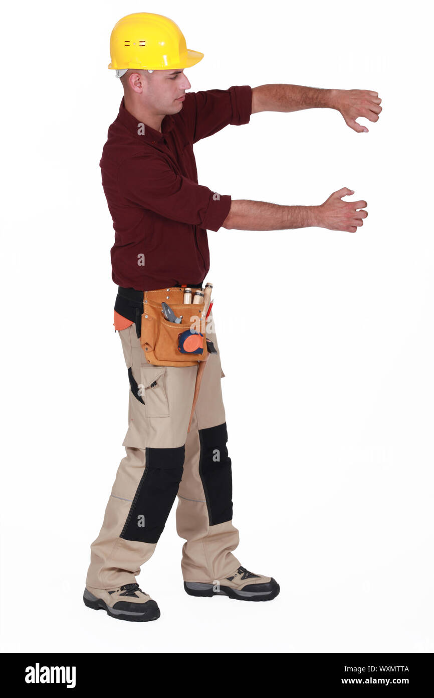 Builder performing pull action Stock Photo - Alamy