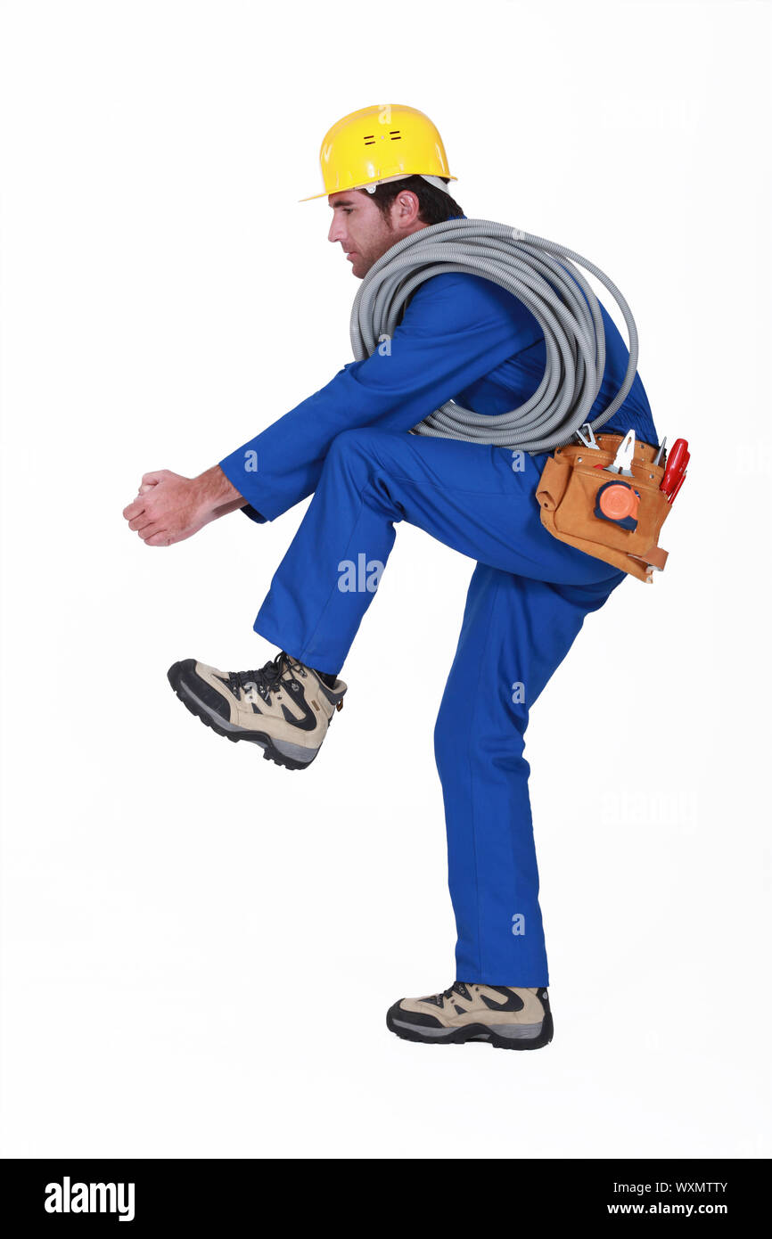 plumber in profile pulling something Stock Photo - Alamy