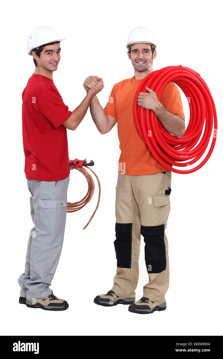 Two plumbers work hi-res stock photography and images - Alamy