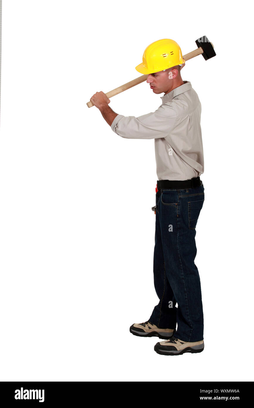 craftsman hitting with his hammer Stock Photo - Alamy