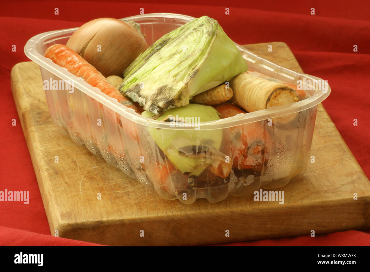 mouldy organic vegetable unhealthy to eat on a timber board Stock Photo ...