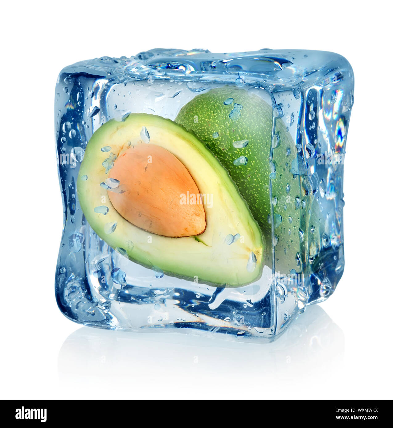 Avocado in ice cube isolated on a white background Stock Photo - Alamy