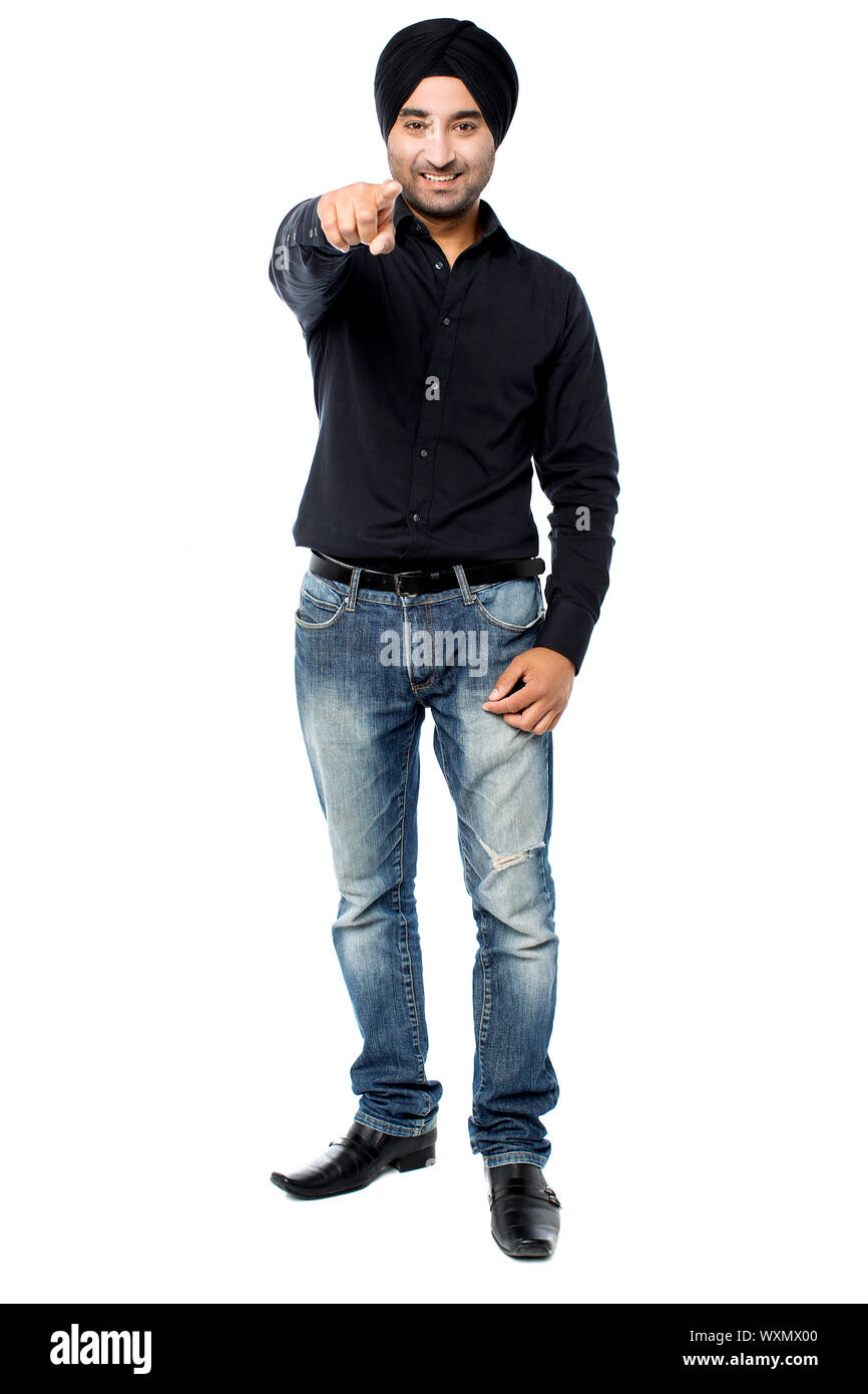 Handsome young man pointing towards camera Stock Photo - Alamy
