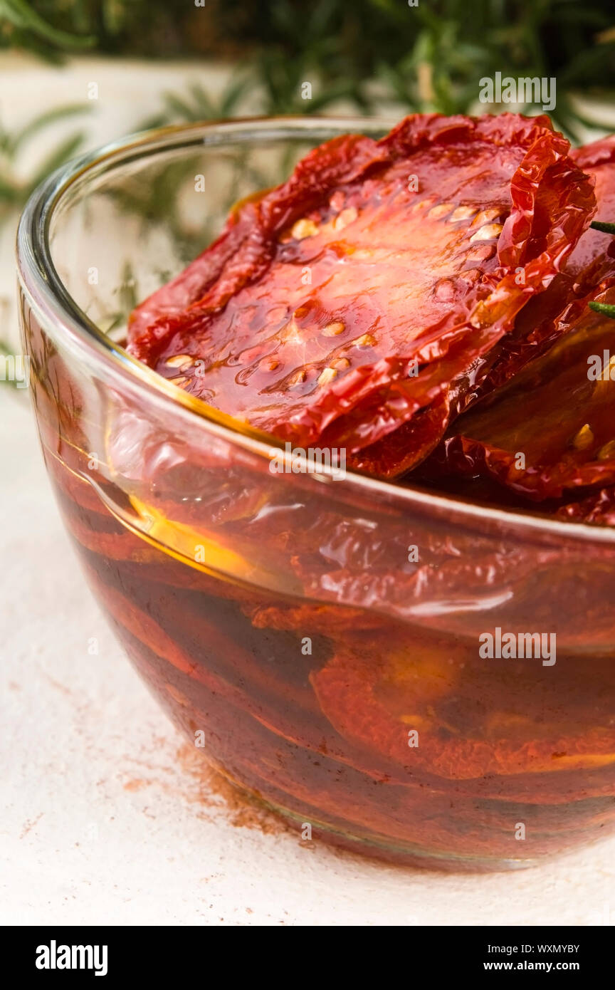 Sun dried tomatoes with olive oil Stock Photo - Alamy