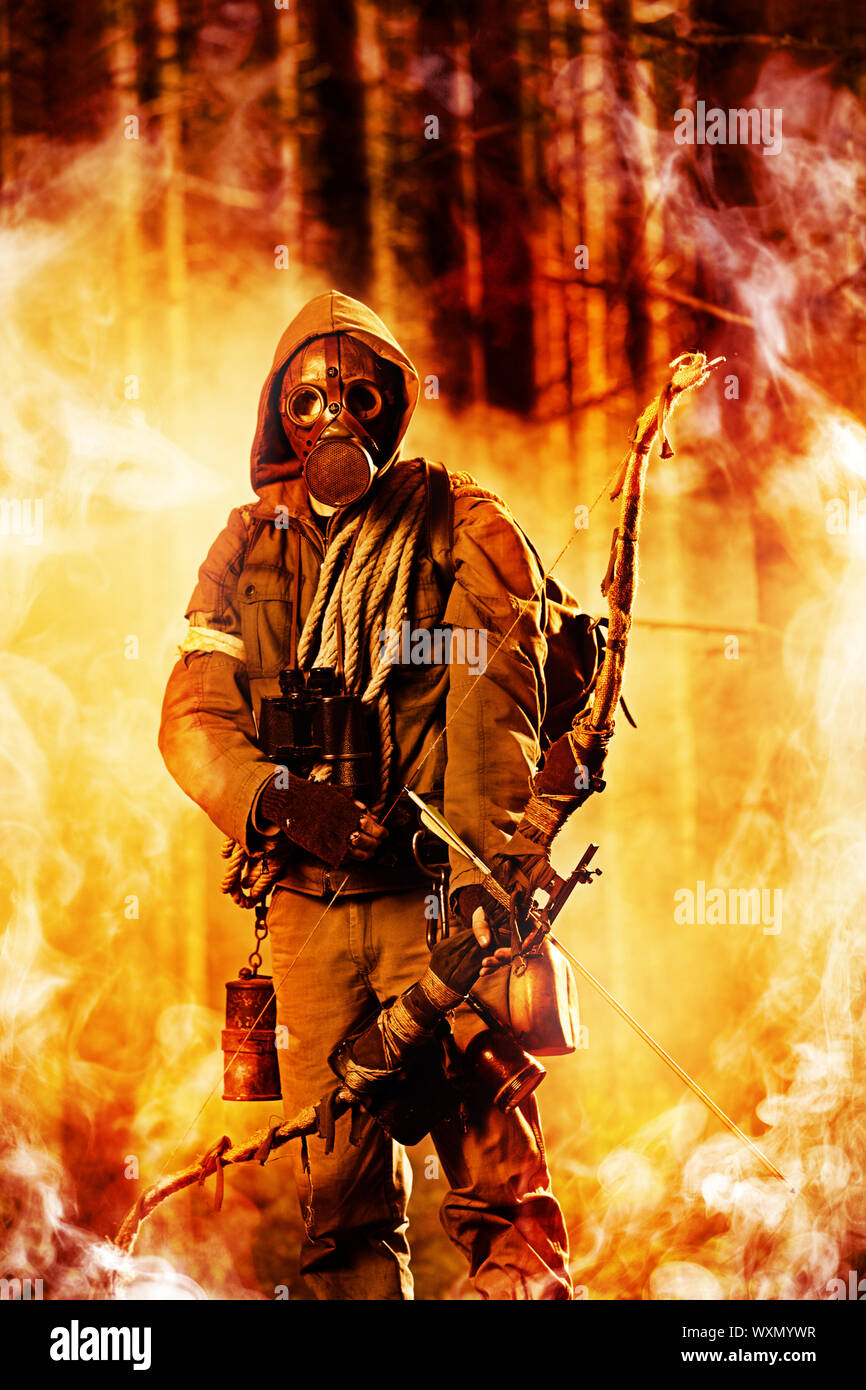 Soldier with a bow in a forest on fire Stock Photo - Alamy