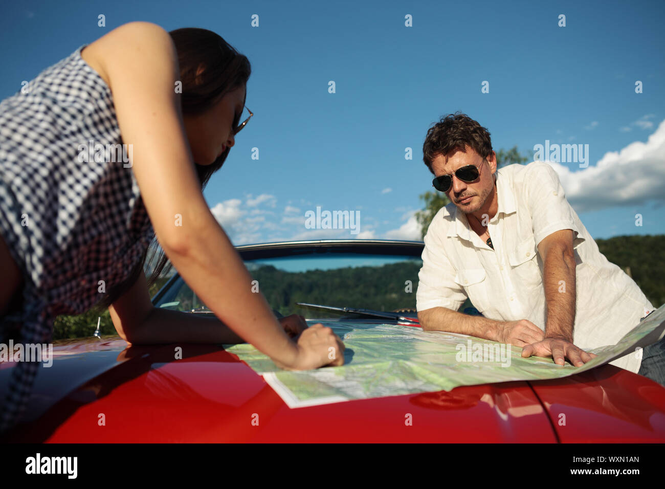 Beautiful couple trying to find their way Stock Photo - Alamy