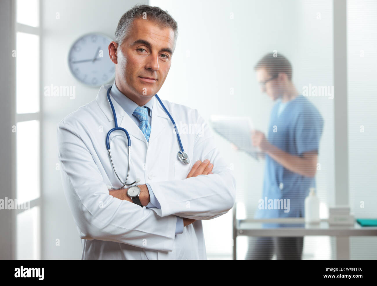 Portrait of a handsome male doctor, nurse on background Stock Photo - Alamy