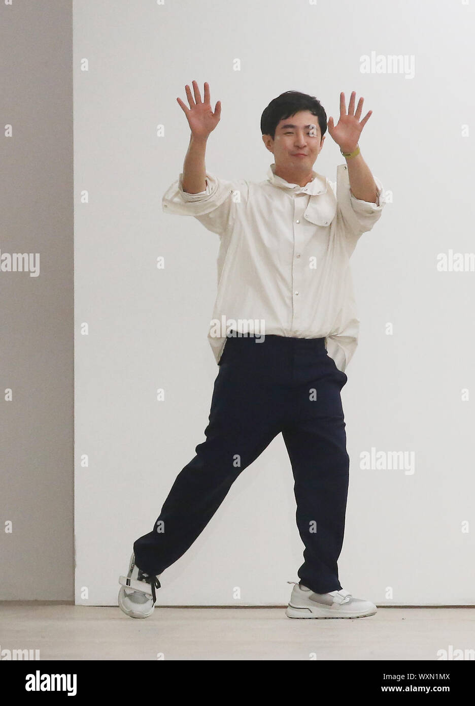 Korean designer Yoon Choon Ho acknowledges the audience following the ...