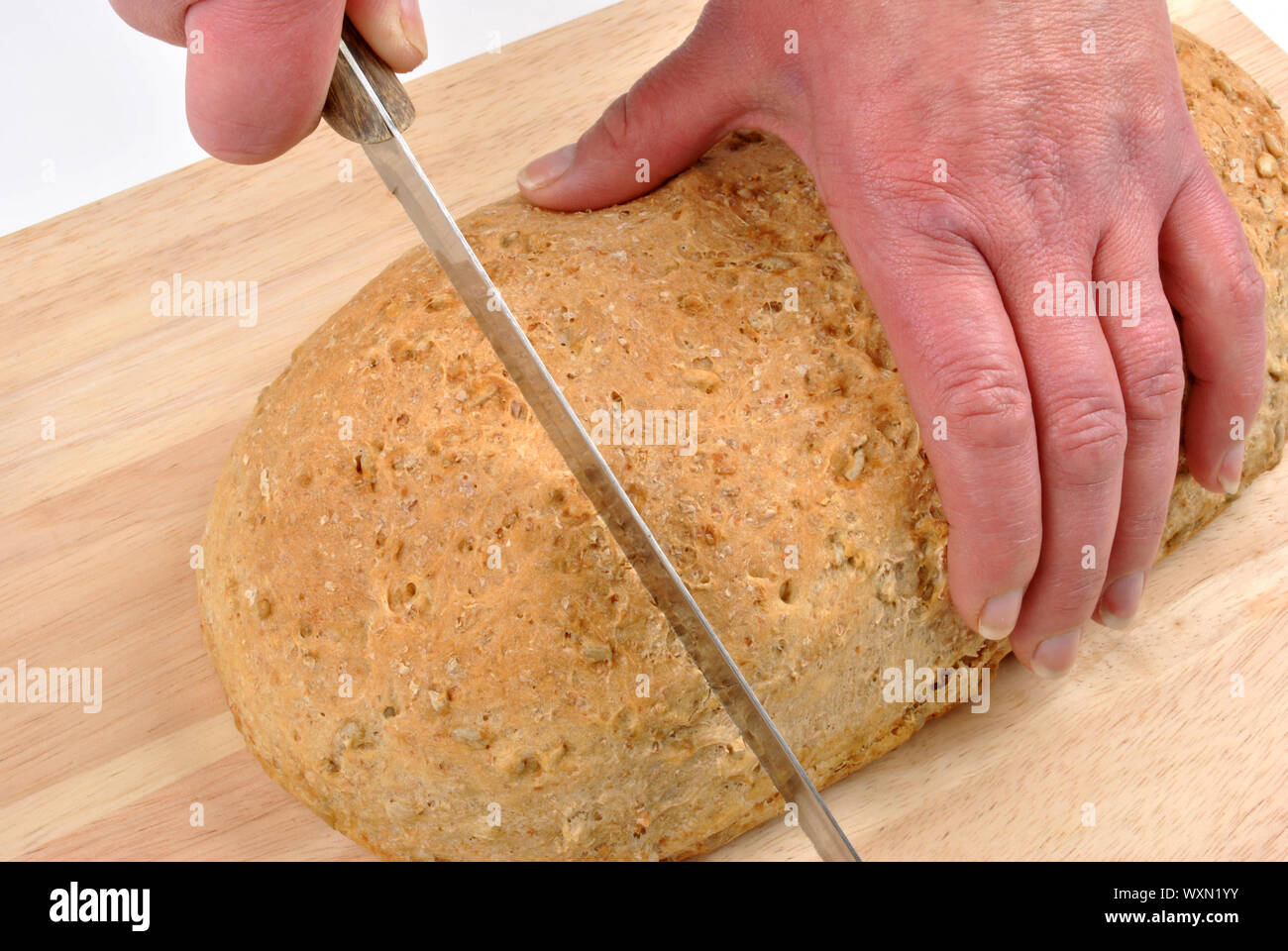 how to cut organic bread at home Stock Photo - Alamy