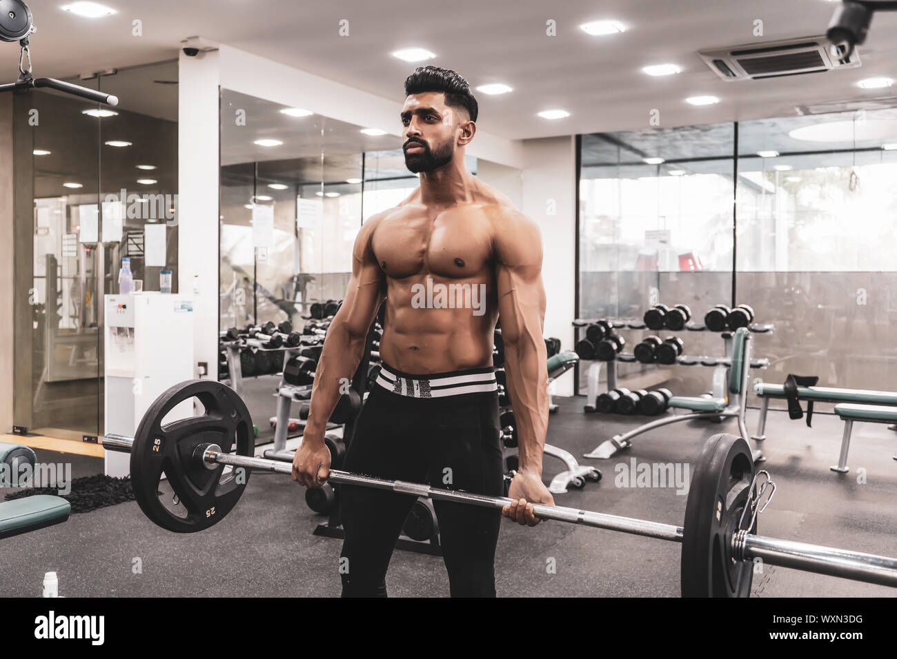 Muscular Man Doing Heavy Deadlift Exercise. Young athlete getting ready ...
