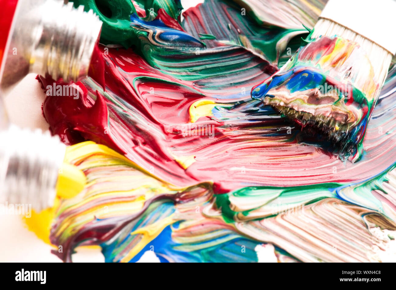 Brush mixing paint on palette Stock Photo - Alamy