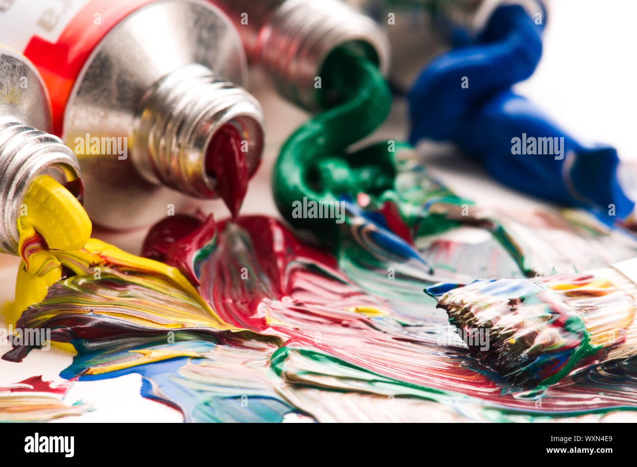 Brush mixing paint on palette Stock Photo - Alamy
