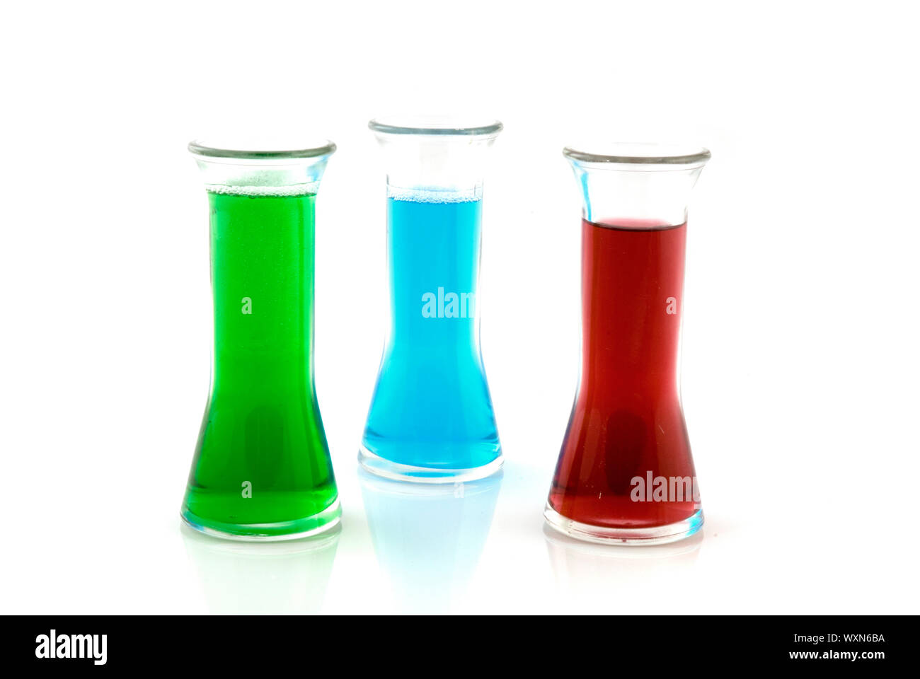 colored liquid in glass bottles Stock Photo - Alamy