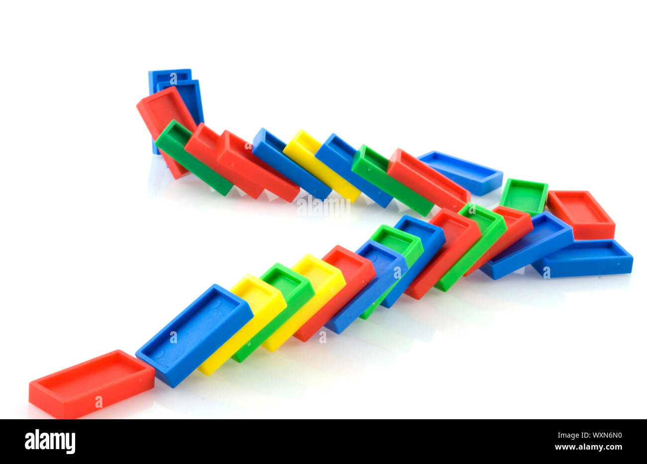 fallen domino rally in colors Stock Photo - Alamy