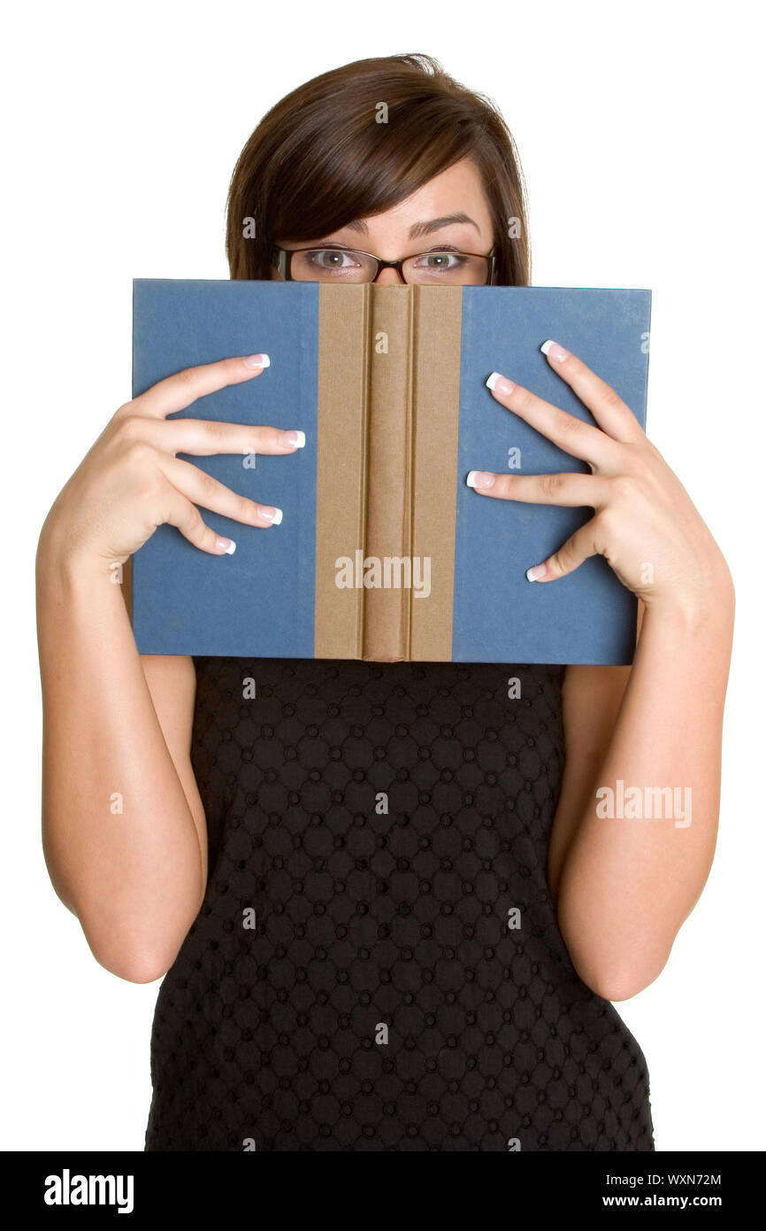 Beautiful woman looking over book Stock Photo - Alamy