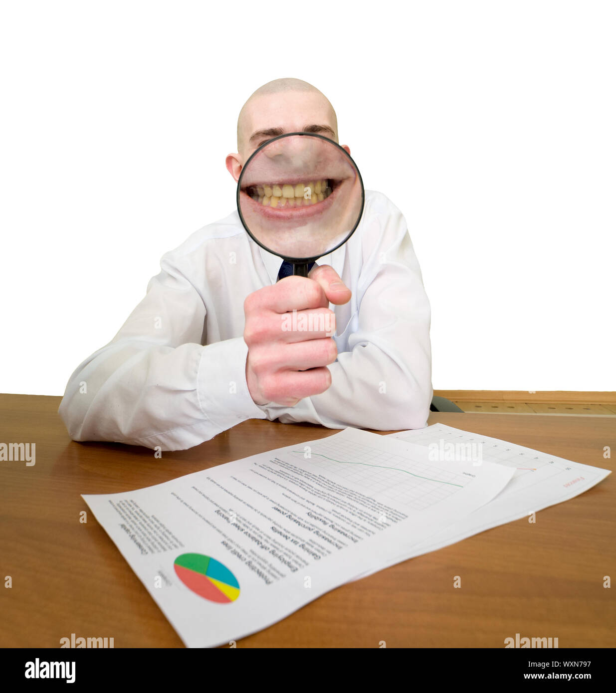 The guy looks through the big magnifier Stock Photo - Alamy