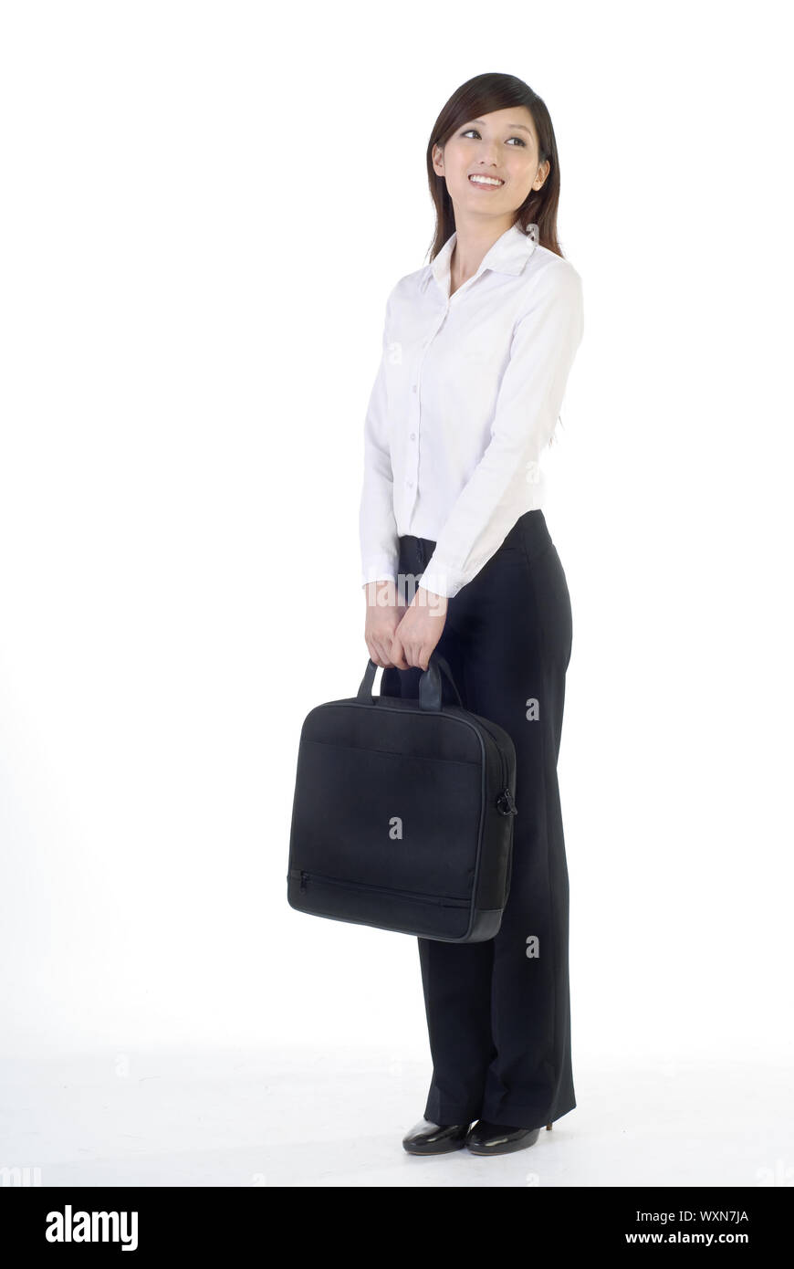 Full length portrait of Asian business woman with briefcase standing on ...