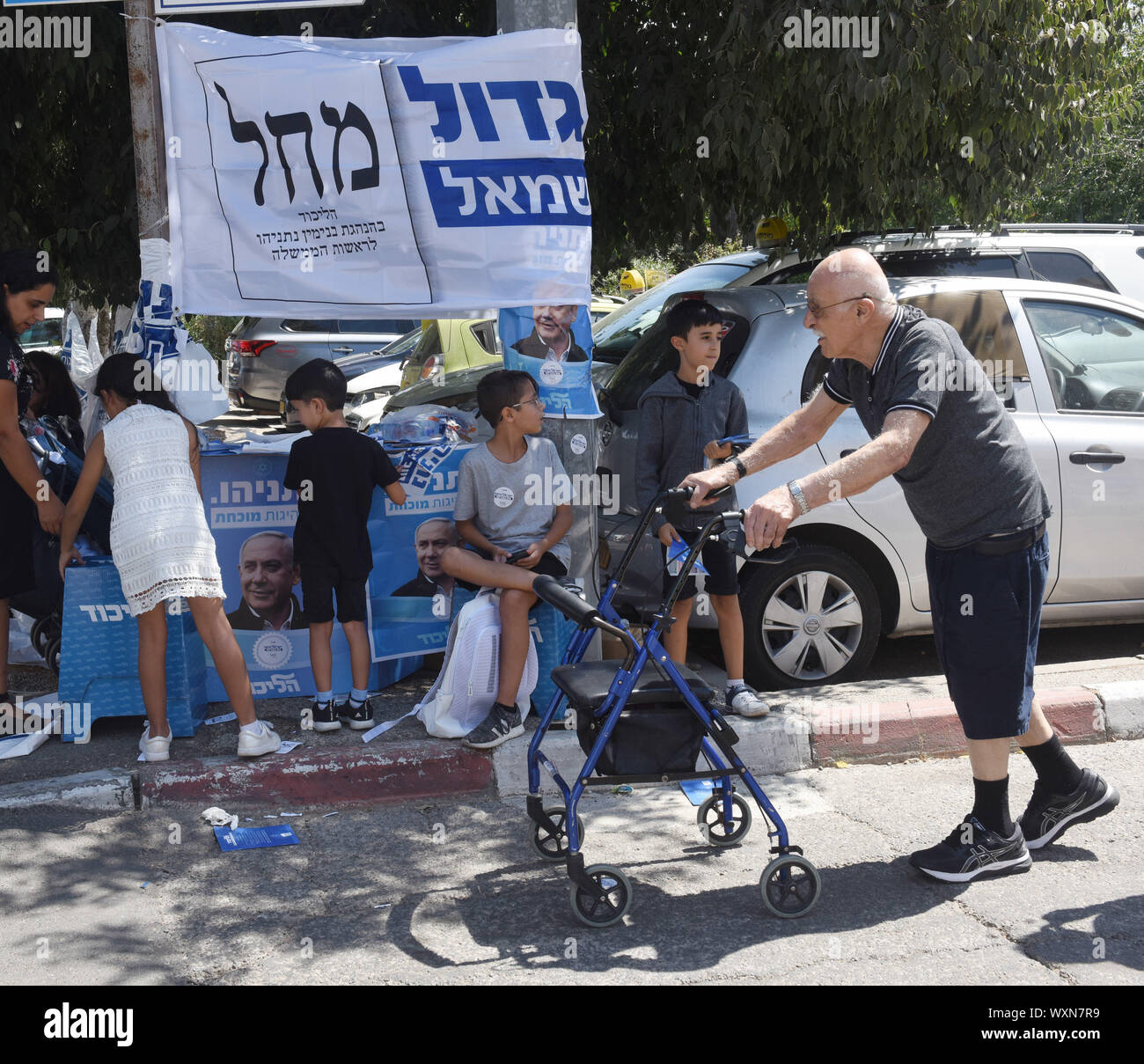 Jerusalem, Israel. 17th Sep 2019. A man walks past campaign signs for ...