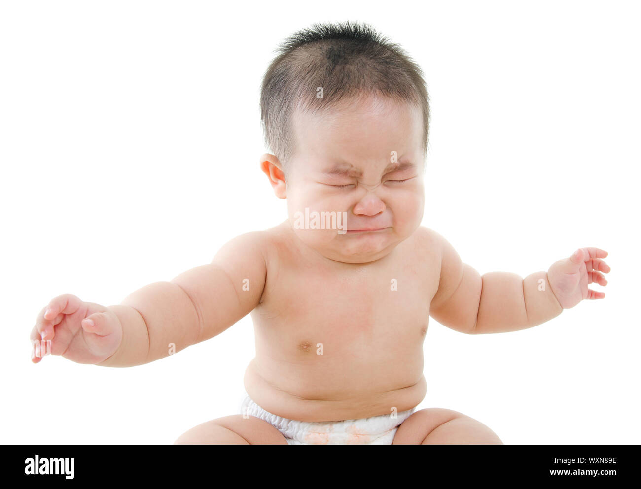 Upset Asian baby boy crying, sitting isolated on white background Stock ...
