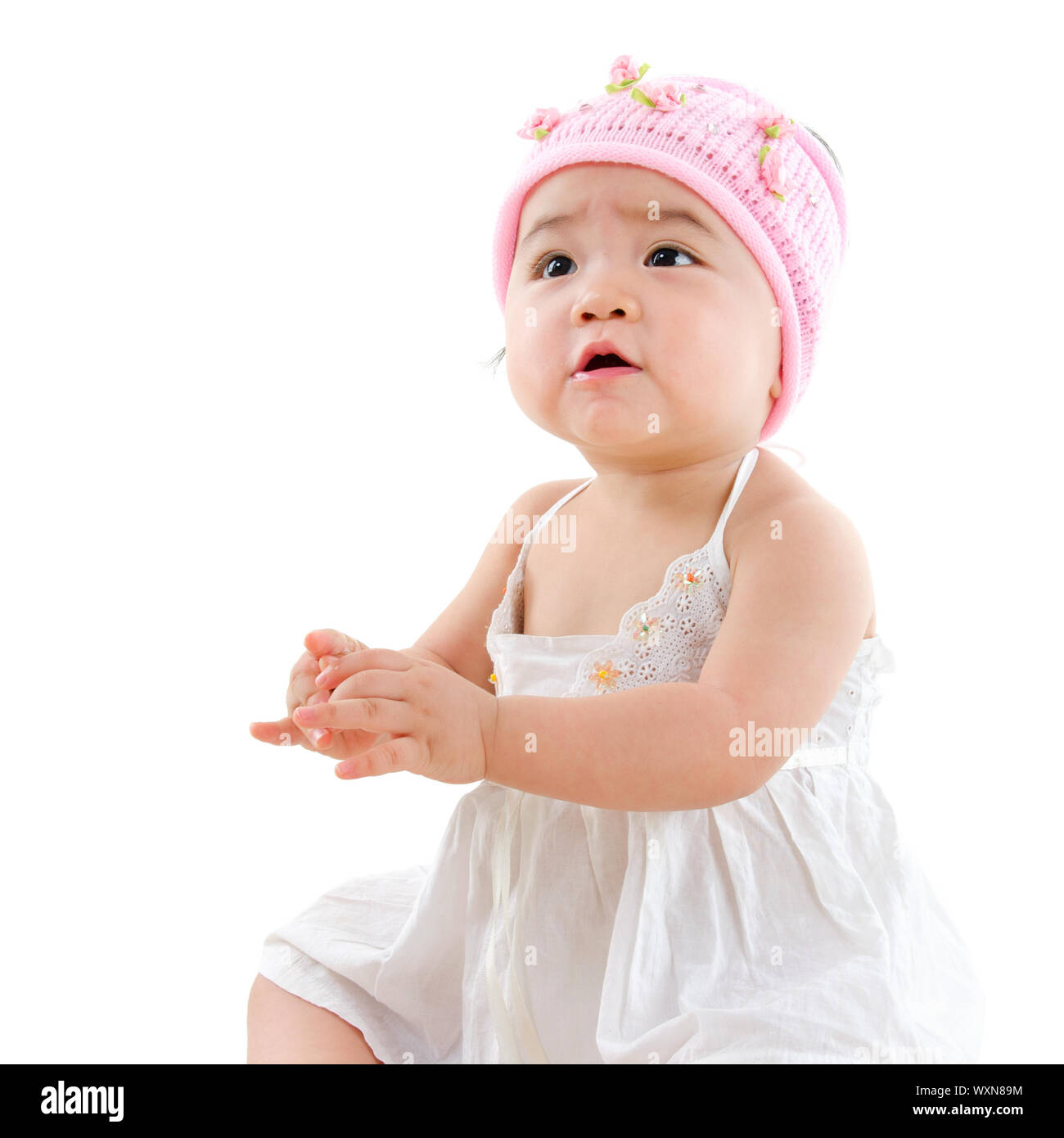 Portrait of cute Asian baby girl looking up, isolated on white background Stock Photo - Alamy