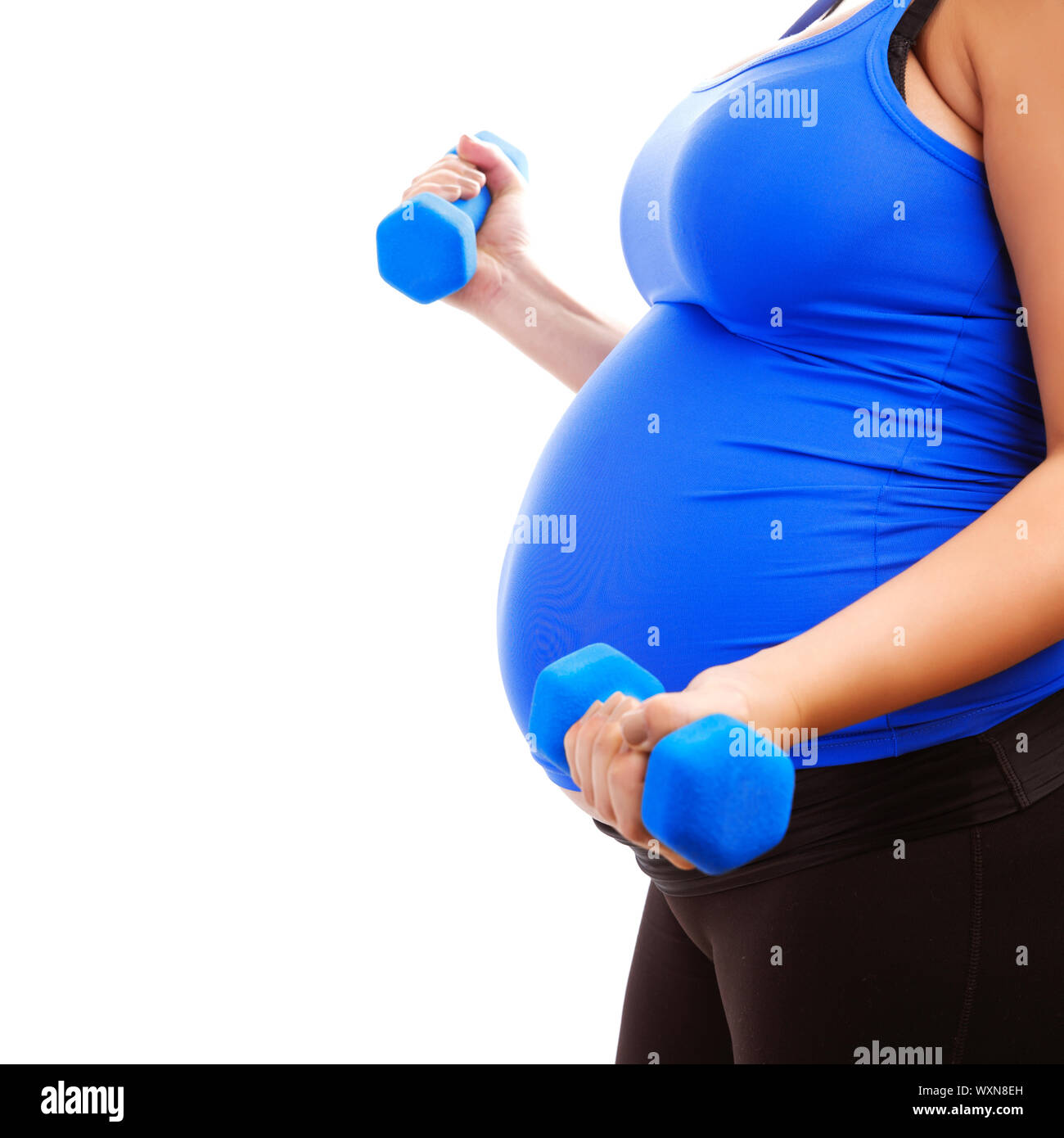 Expectant girl do fitness indoors, isolated on white background, side ...