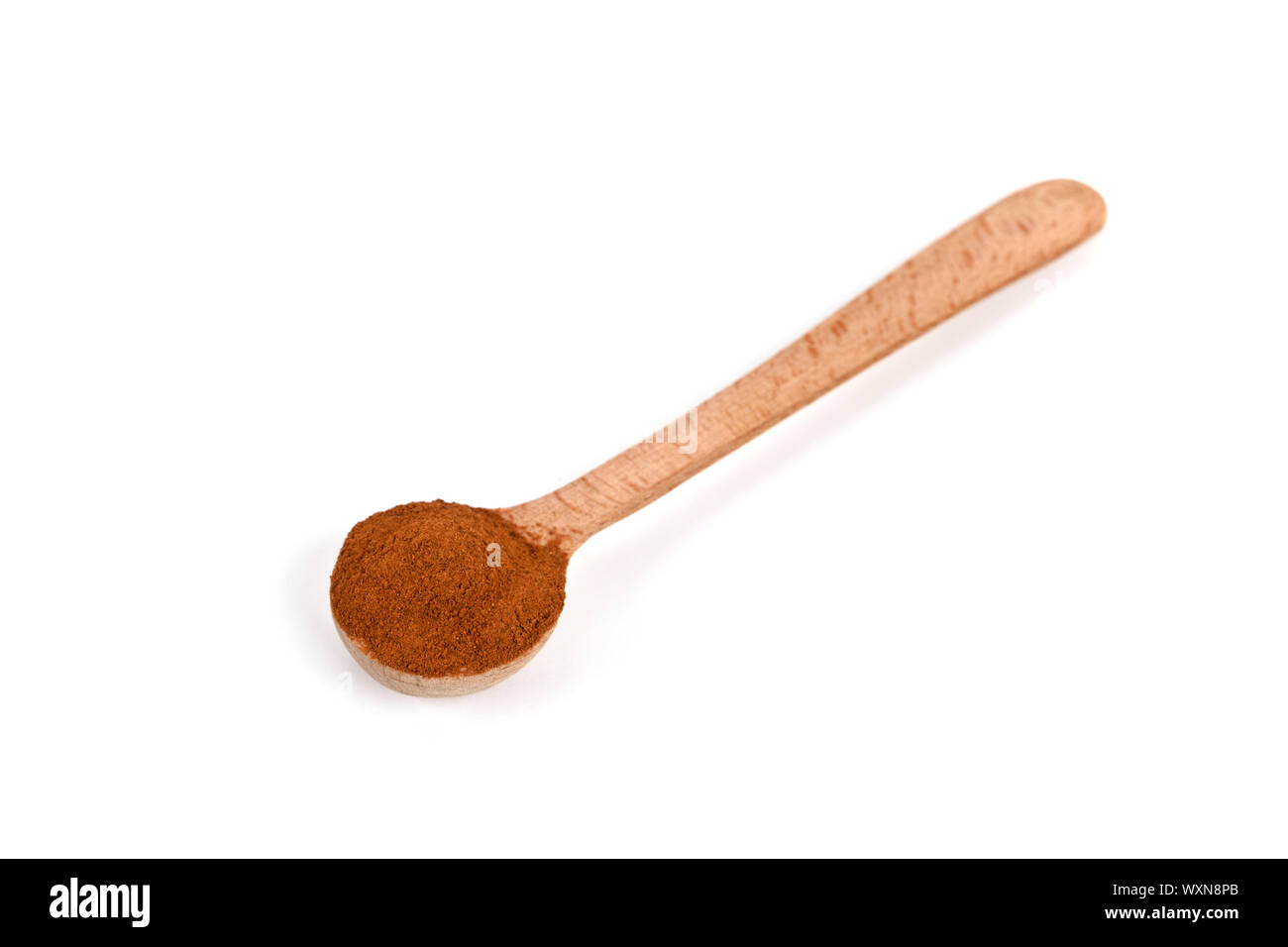 ground cinnamon in wooden spoon isolated on white background Stock ...