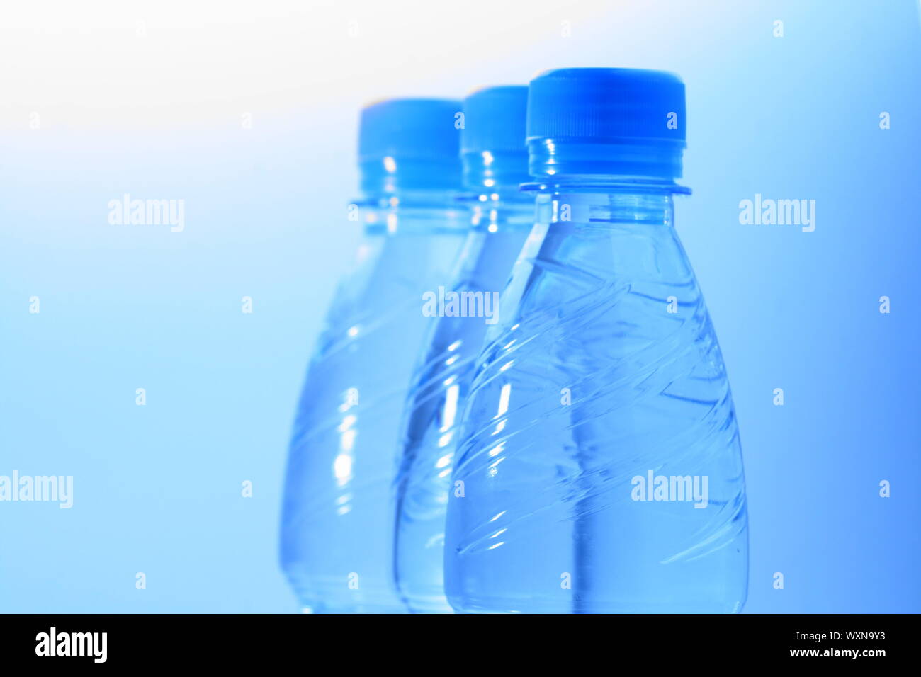 clear cold blue water in bottle Stock Photo - Alamy