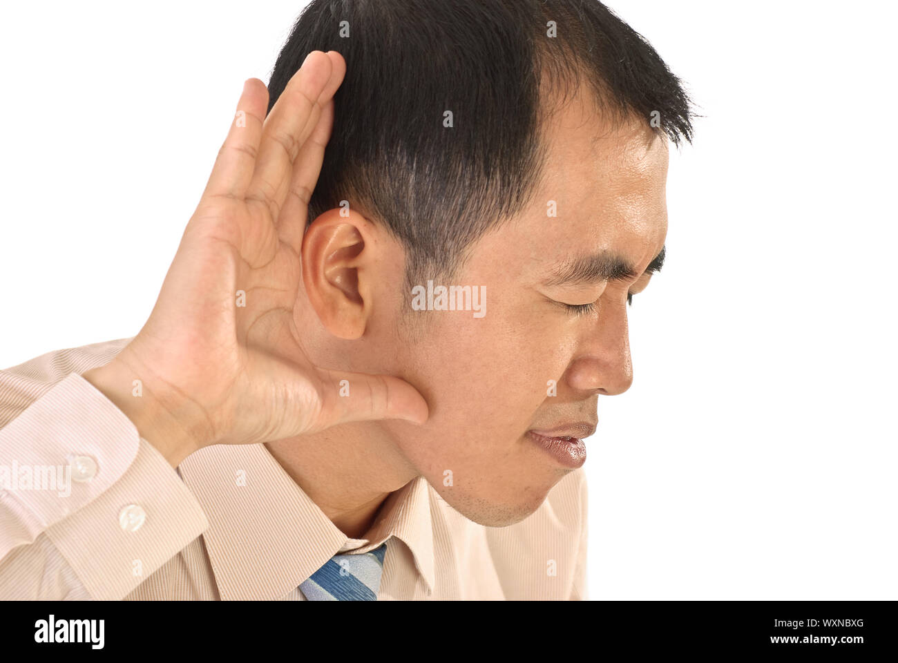 Listen sign with hand on ear, closeup portrait of Asian business man ...