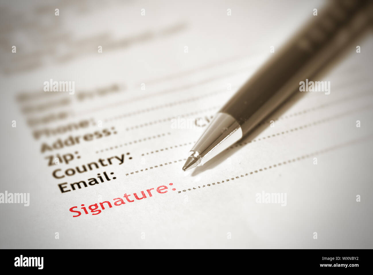 Signature on paper with pen in brown color Stock Photo - Alamy