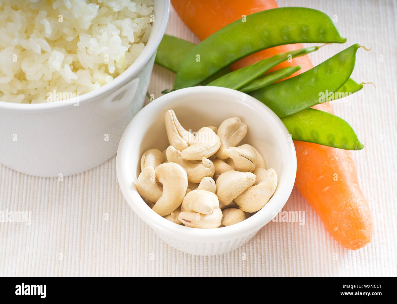 fresh cashew nut and vegetables,with steamed white rice ,typical ...