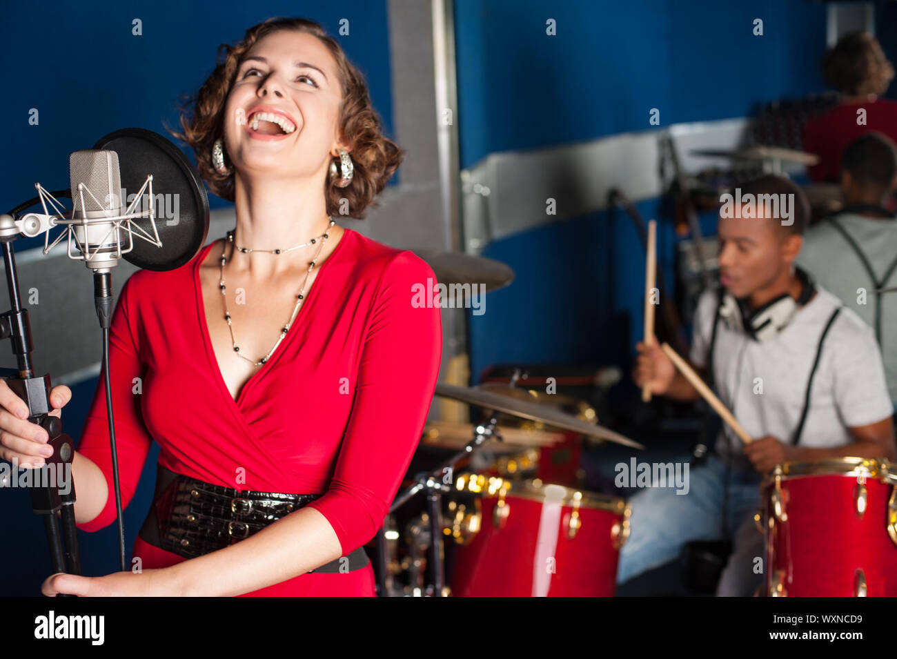Female singer recording a song in studio Stock Photo - Alamy