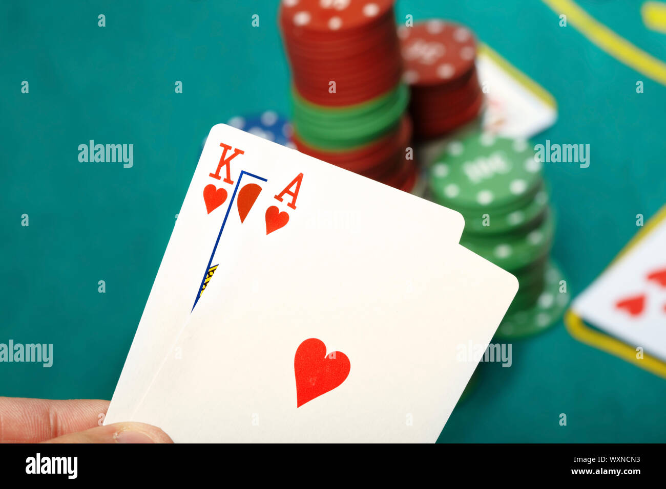 Human hand holding two cards hi-res stock photography and images - Alamy